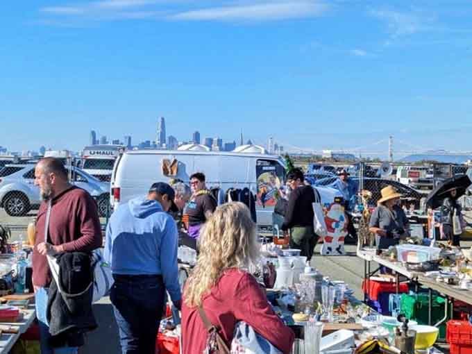 The San Francisco skyline gleams in the distance as treasure hunters browse tables overflowing with vintage finds and memories.