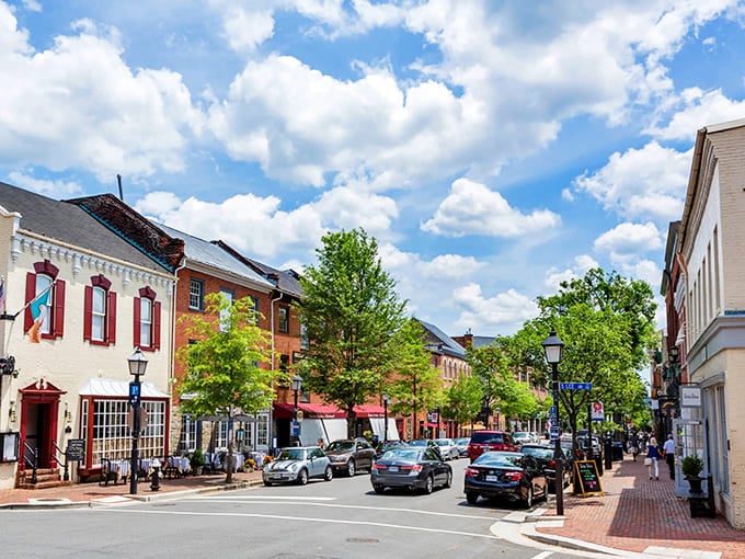 Brick sidewalks and colorful awnings frame a Main Street where mountains provide the perfect backdrop for small-town life.