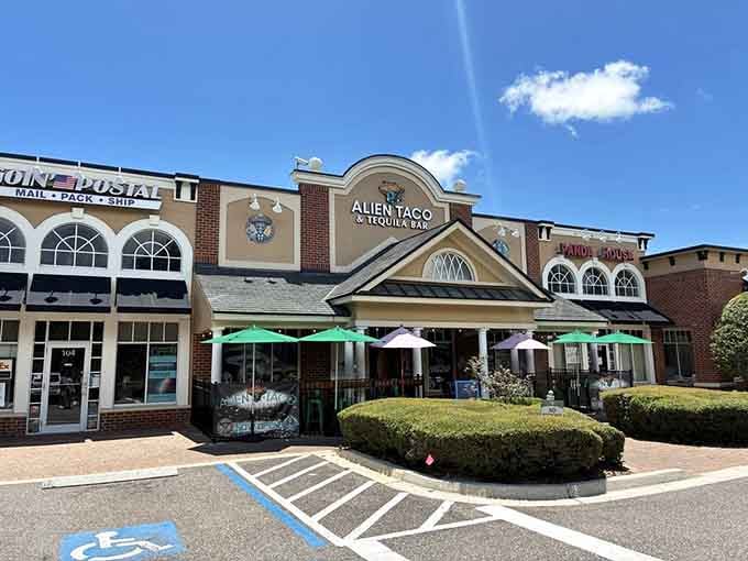 Bright umbrellas dot the patio like colorful UFOs that landed specifically to shade your margarita-sipping afternoon.