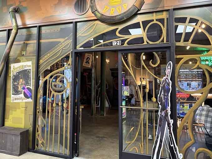 The ornate entrance invites you into a realm where vintage arcade games and creative cocktails collide in glorious harmony.