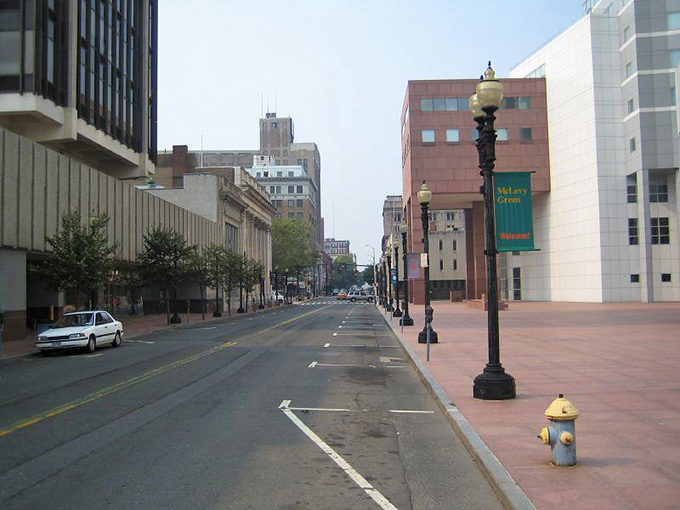 Wide sidewalks and classic lampposts line this quiet downtown stretch, where the pace slows down and city life feels manageable.