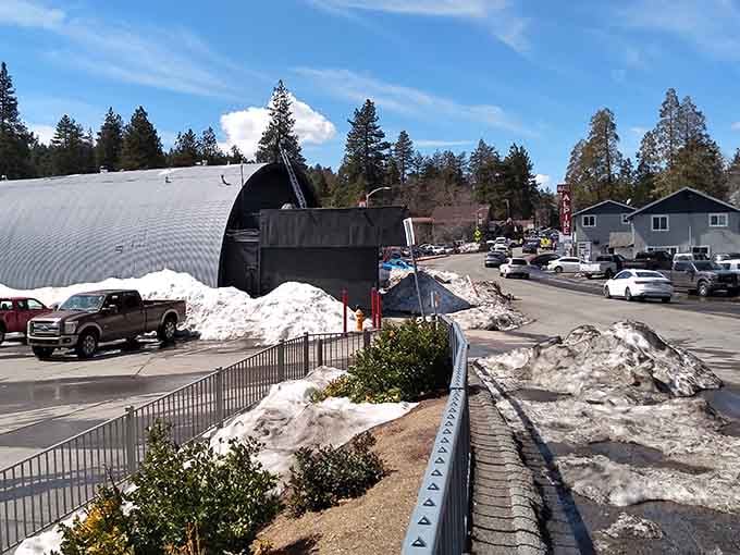 Winter's last snow melts slowly here where mountain life moves to nature's rhythm instead of rush-hour traffic.