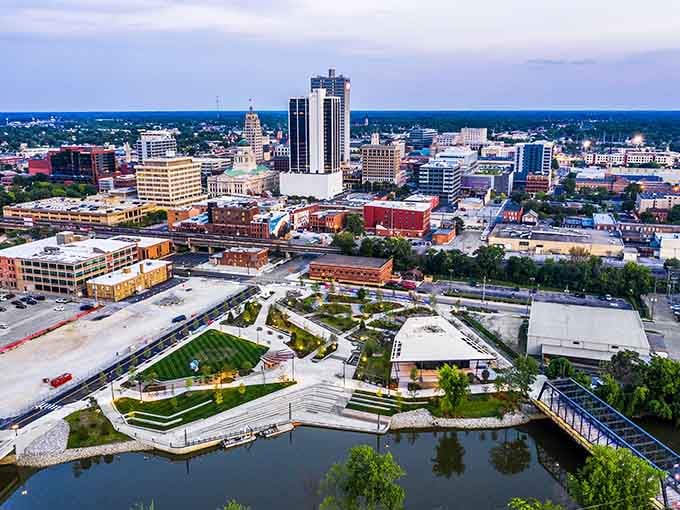 Sunset paints the downtown in golden hues as parks and waterways weave through the urban fabric like nature's own design.