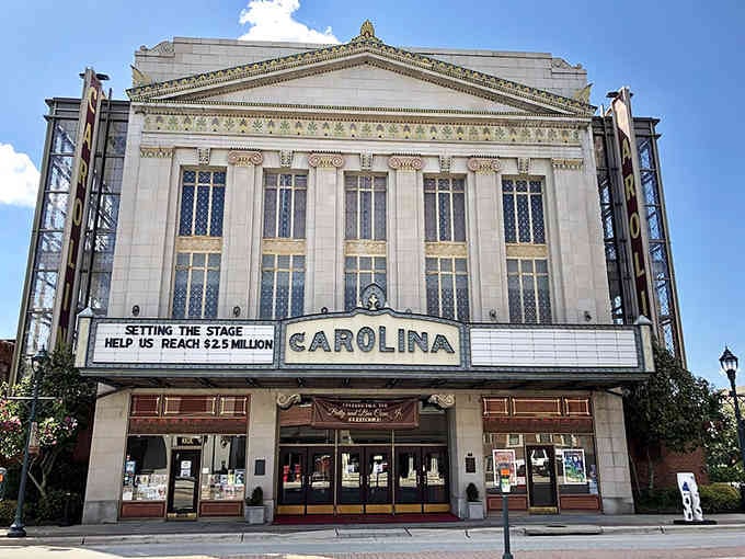 Grand theater facades promise entertainment like golden age Hollywood glamour never truly faded.
