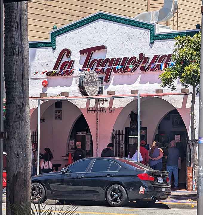 The pink building stands proud on Mission Street, serving tacos that have earned their legendary status bite by bite.