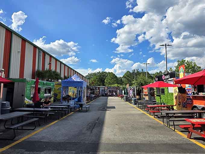 Dramatic clouds roll over outdoor food stalls where the aroma of fresh cooking mingles with bargain-hunting excitement.