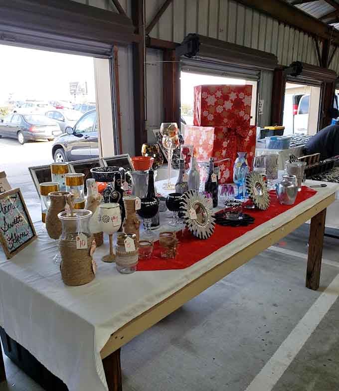 Vintage glassware and handmade crafts arranged beautifully show that presentation matters, even at a flea market booth.