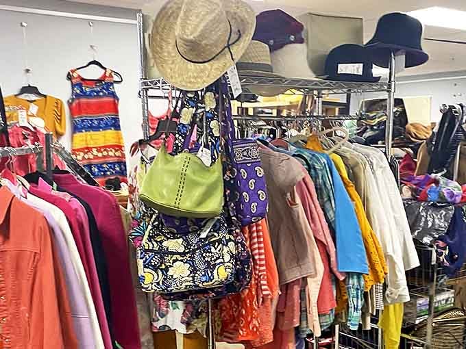 A rainbow of clothing awaits eager shoppers at this Minnesota thrift store. Each rack a potential goldmine of style and savings.