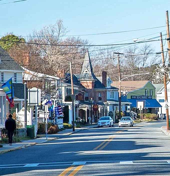 St. Michaels' colorful main street features flags and festive decorations, creating a cheerful atmosphere for day-trippers on a budget.