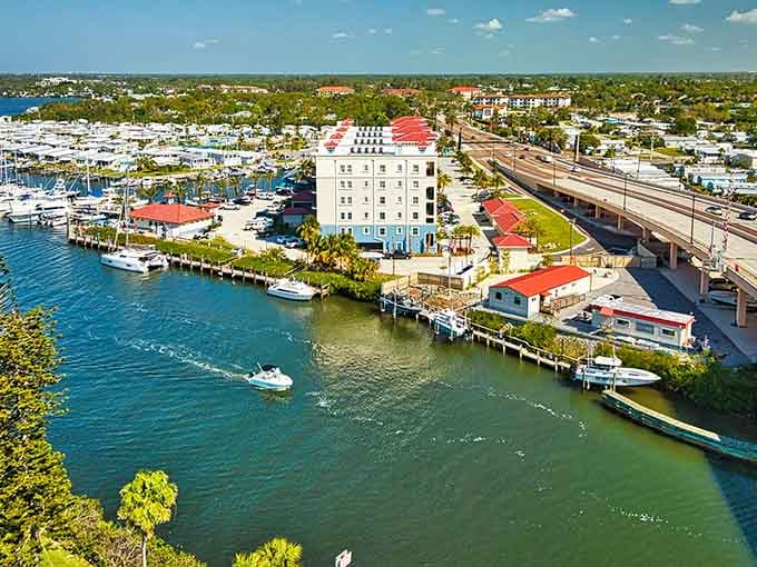 The historic waterfront district spreads along turquoise waters where fishing boats and pleasure craft share the marina.