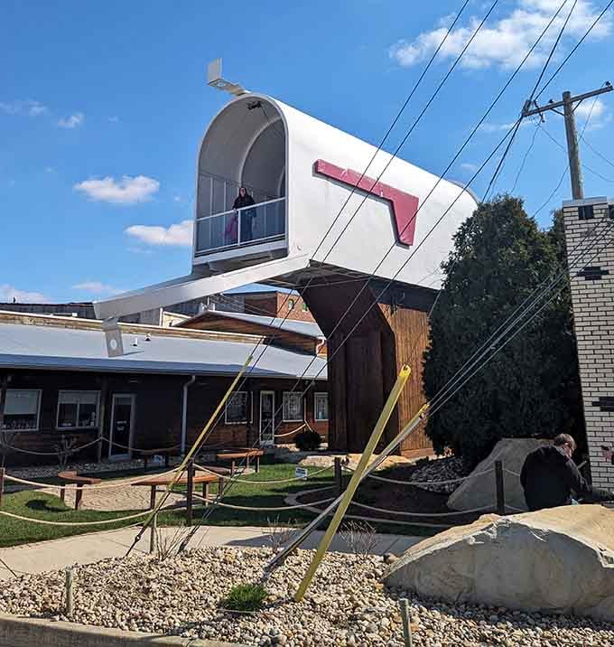 Mail carriers would need a ladder truck to deliver to this mammoth mailbox. The red flag alone could signal ships at sea!