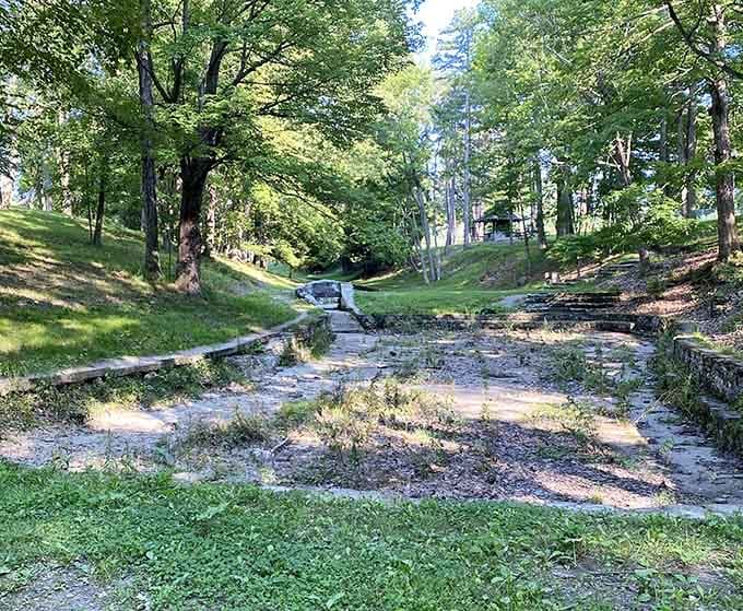 Allen Park's stone pathways wind through lush greenery, offering a peaceful retreat that feels miles away from city life despite being minutes from downtown.