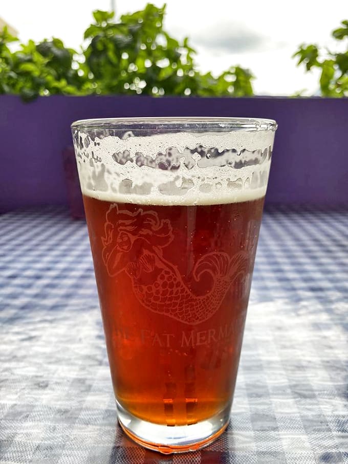 That perfect amber beer, served in a glass etched with the restaurant's namesake mermaid, tastes even better with a mountain view.