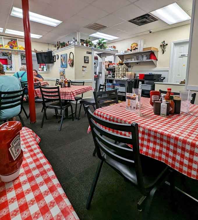 The dining room's cozy charm and red support beam give off serious "eating at a friend's house" vibes, intentionally.
