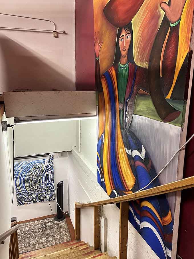 Even the stairway promises more treasures, because apparently one floor of books simply wasn't enough for anyone.