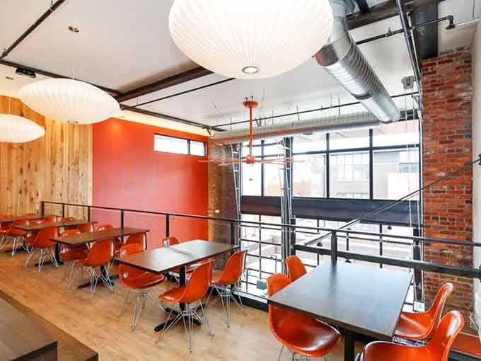 The second-floor seating offers prime people-watching while you contemplate ordering another round of bacon chocolate pancakes.