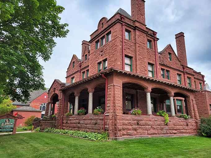 The Al. Ringling Mansion's red sandstone exterior screams "circus money bought this," and boy, did they spend it well.