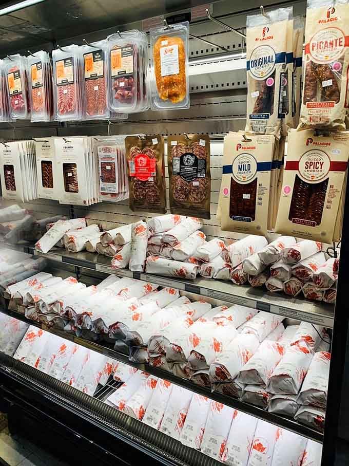 The meat section displays salami and prosciutto like precious jewels, because honestly, that's exactly what they are here.