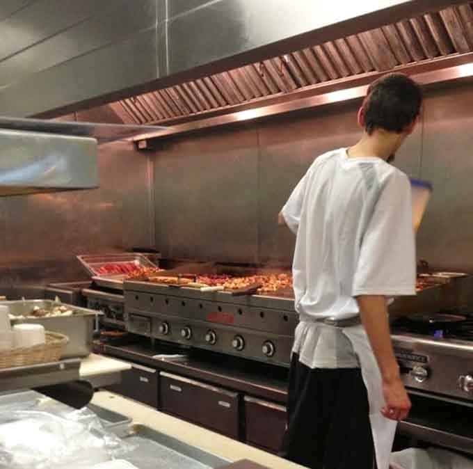 The kitchen crew working their breakfast magic, turning simple ingredients into the kind of meals people drive across town for.