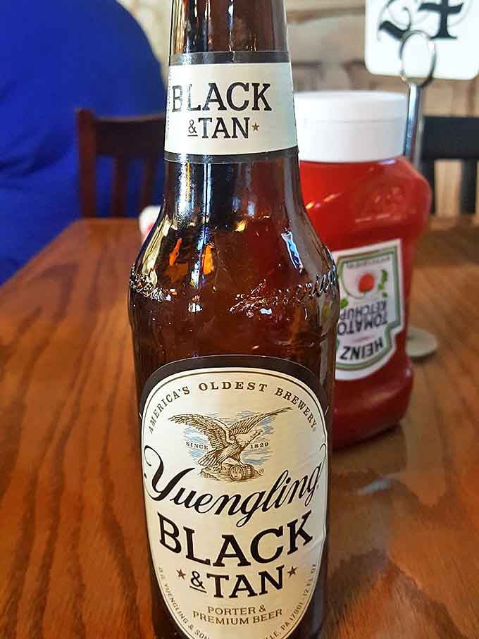 A Yuengling Black & Tan standing guard next to what appears to be the house BBQ sauce&mdash;a pairing as natural as porch swings and summer evenings.