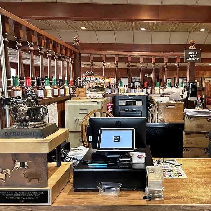 The counter displays championship trophies like a hall of fame, reminding you this isn't their first rodeo.