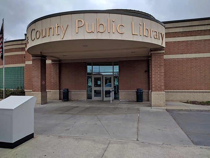 The public library stands ready to serve the community, proving some institutions still value access over profit margins.