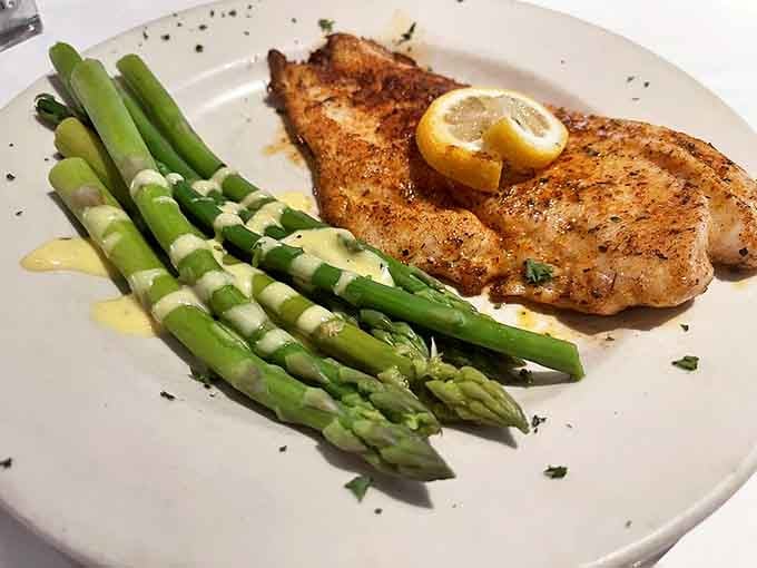 Blackened redfish that's not trying to set your mouth on fire&mdash;just deliver perfectly seasoned fish alongside asparagus drizzled with hollandaise that's worth every calorie.