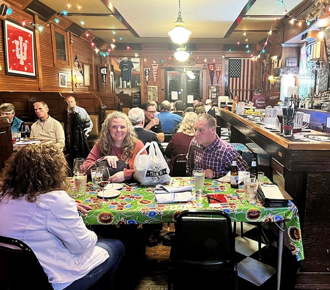 Happy diners enjoying their meals in a space that feels like your favorite aunt's house, if she served gourmet cuisine.