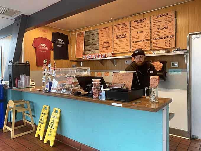 Behind that turquoise counter, the team works their magic turning out nationally recognized burgers and barbecue.