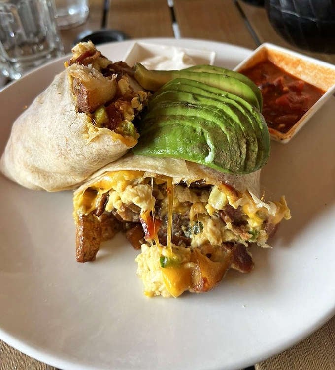 This breakfast burrito has more layers than your favorite novel. That perfectly sliced avocado is nature's butter.