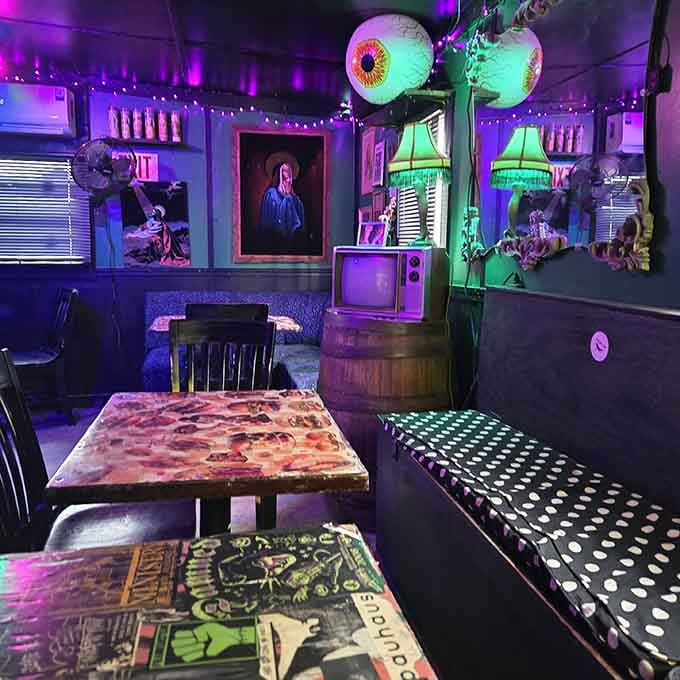 Giant eyeballs, vintage TVs, and mood lighting create an atmosphere that defies all conventional decorating rules beautifully.