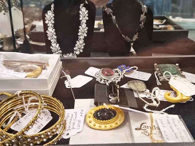 Vintage jewelry sparkling behind glass, each piece once made someone feel absolutely fabulous at a party.