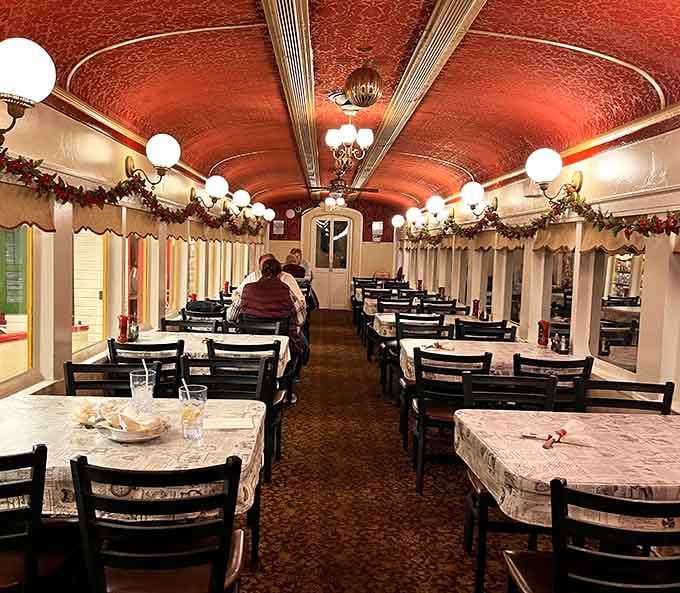The dining car stretches before you with holiday garland, globe lights, and endless possibilities for good eating.