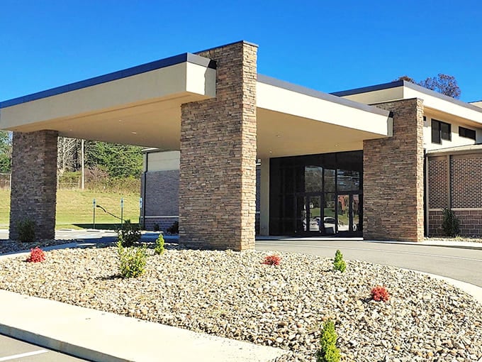 Modern meets mountain tradition at this stone-faced community building, where thoughtful landscaping welcomes visitors with the architectural equivalent of a firm handshake.