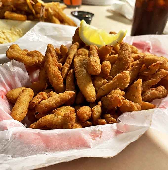 Fried clam strips that actually taste like clams&mdash;crispy, golden, and served with a squeeze of lemon that cuts through the richness perfectly.