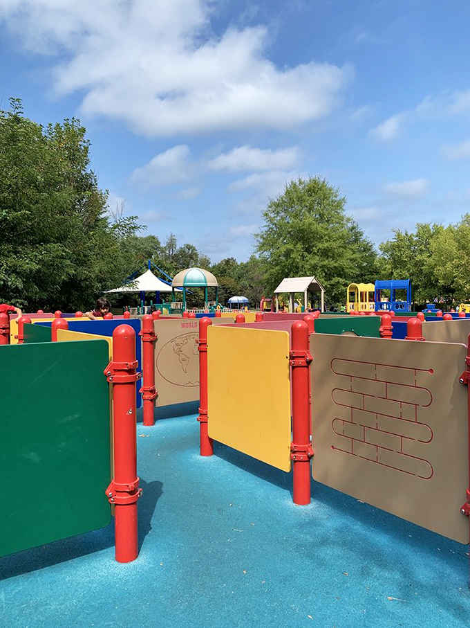 Colorful panels create an interactive maze where little hands can spin, slide, and solve their way through.