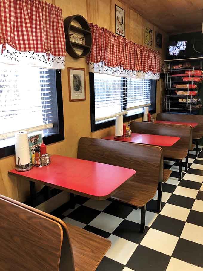 Red gingham curtains and wooden booths: nostalgia you can actually sit in and enjoy.