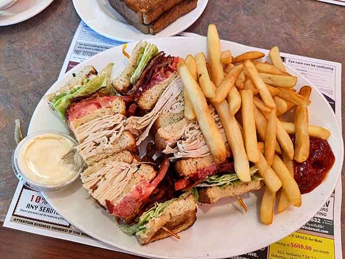 The club sandwich &ndash; architecture you can eat. Layers of deliciousness held together by those little toothpicks of structural integrity.