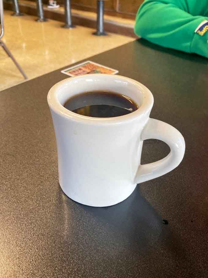 Coffee in a classic diner mug, because some mornings require simplicity and a whole lot of caffeine.