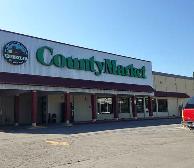 County Market isn't just a grocery store but the town's social hub, where shopping carts become vehicles for neighborhood catch-ups.