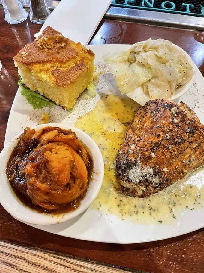 Crab-stuffed salmon with candied yams is the kind of surf-and-turf situation that makes your taste buds throw a party.