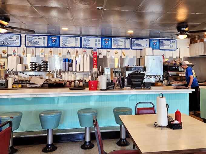 That turquoise counter and chrome stools transport you straight back to when Eisenhower was president and life felt simpler.