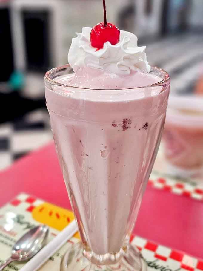 A strawberry shake so thick you'll need biceps like Popeye to get it through that straw, topped with proper whipped cream.