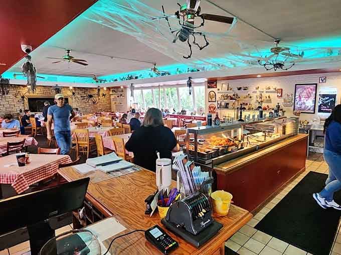 The turquoise ceiling and vintage charm make you feel like you've time-traveled to dinner's golden age.