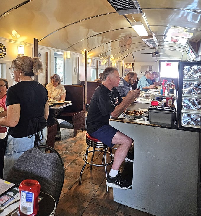 The curved ceiling and counter seating create that classic diner atmosphere where calories don't count and coffee refills are practically mandatory.