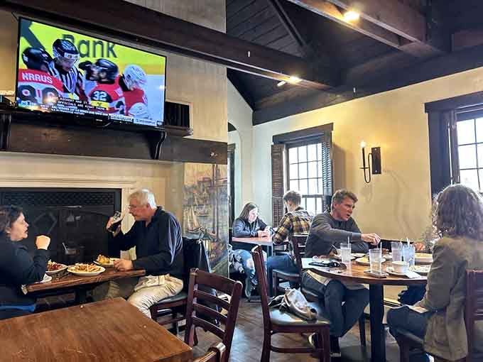Diners enjoying a meal beneath historic beams &ndash; where conversations today might echo the same themes discussed by patrons 240 years ago.