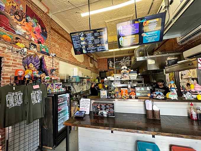 The counter where magic happens, surrounded by collectibles and menu boards, this is command central for noodle excellence.