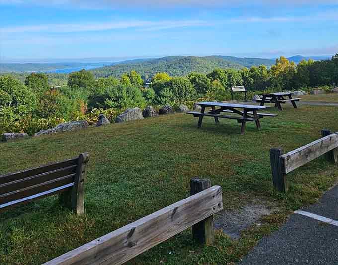 Picnic tables positioned perfectly for maximum scenery consumption, no reservations required for this dining experience.