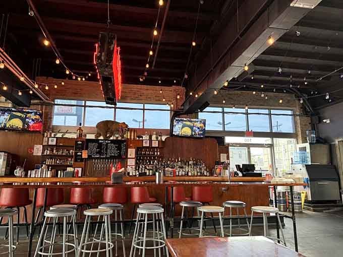 A bar that stretches invitingly across the space, ready to pour whatever you need to complement your smoked meats.