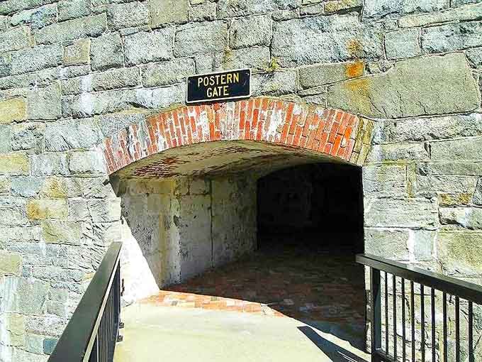 The Postern Gate's weathered brick archway leads to hidden passages, like finding a secret door in your own backyard.